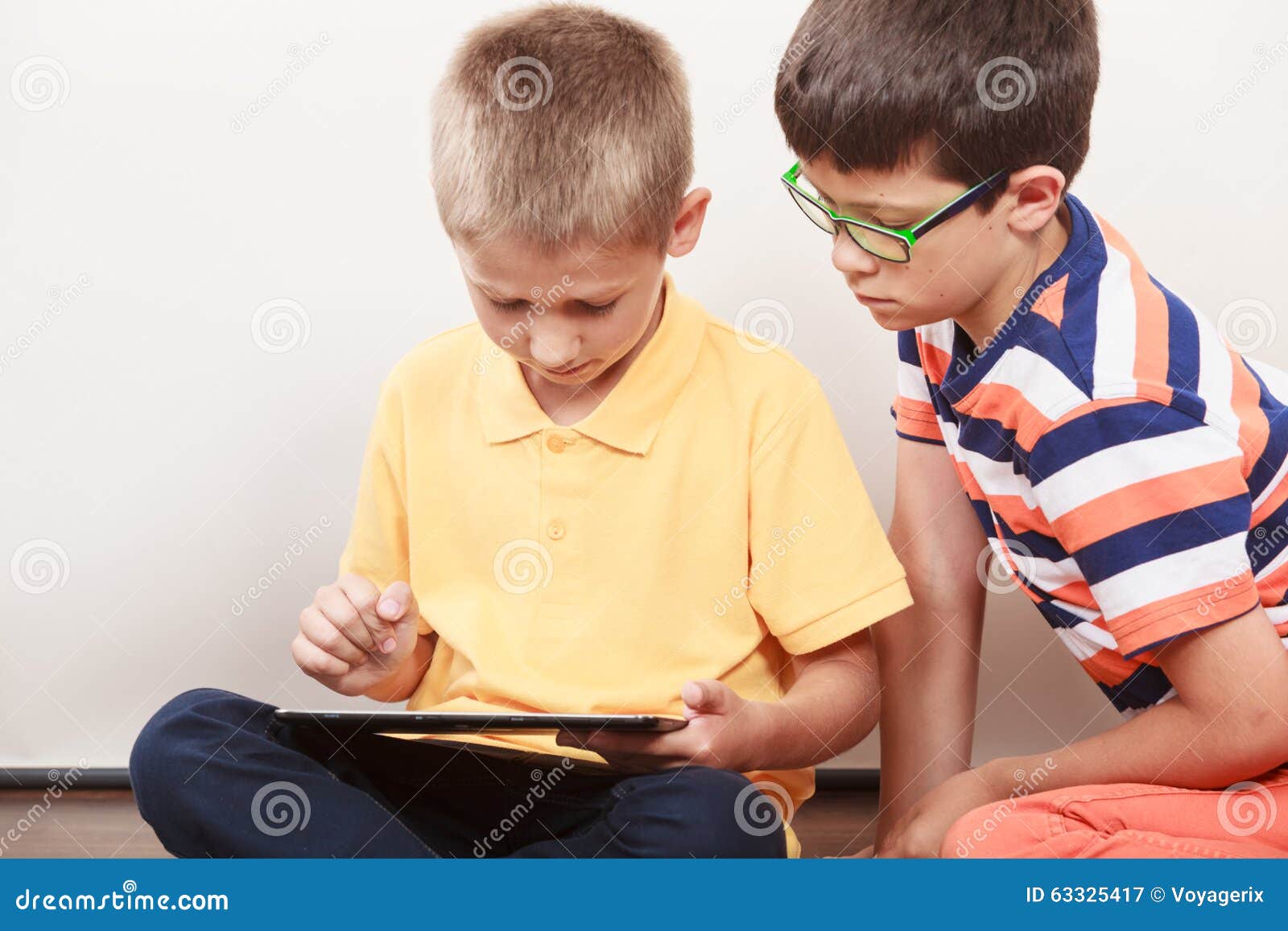 Children Playing on Tablet. Stock Image - Image of elementary ...