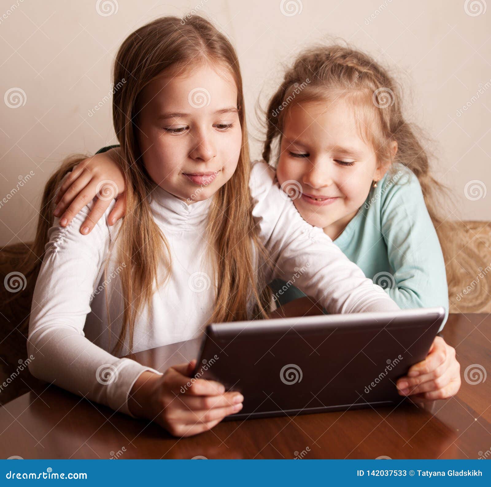 Children playing on tablet stock image. Image of computers - 142037533
