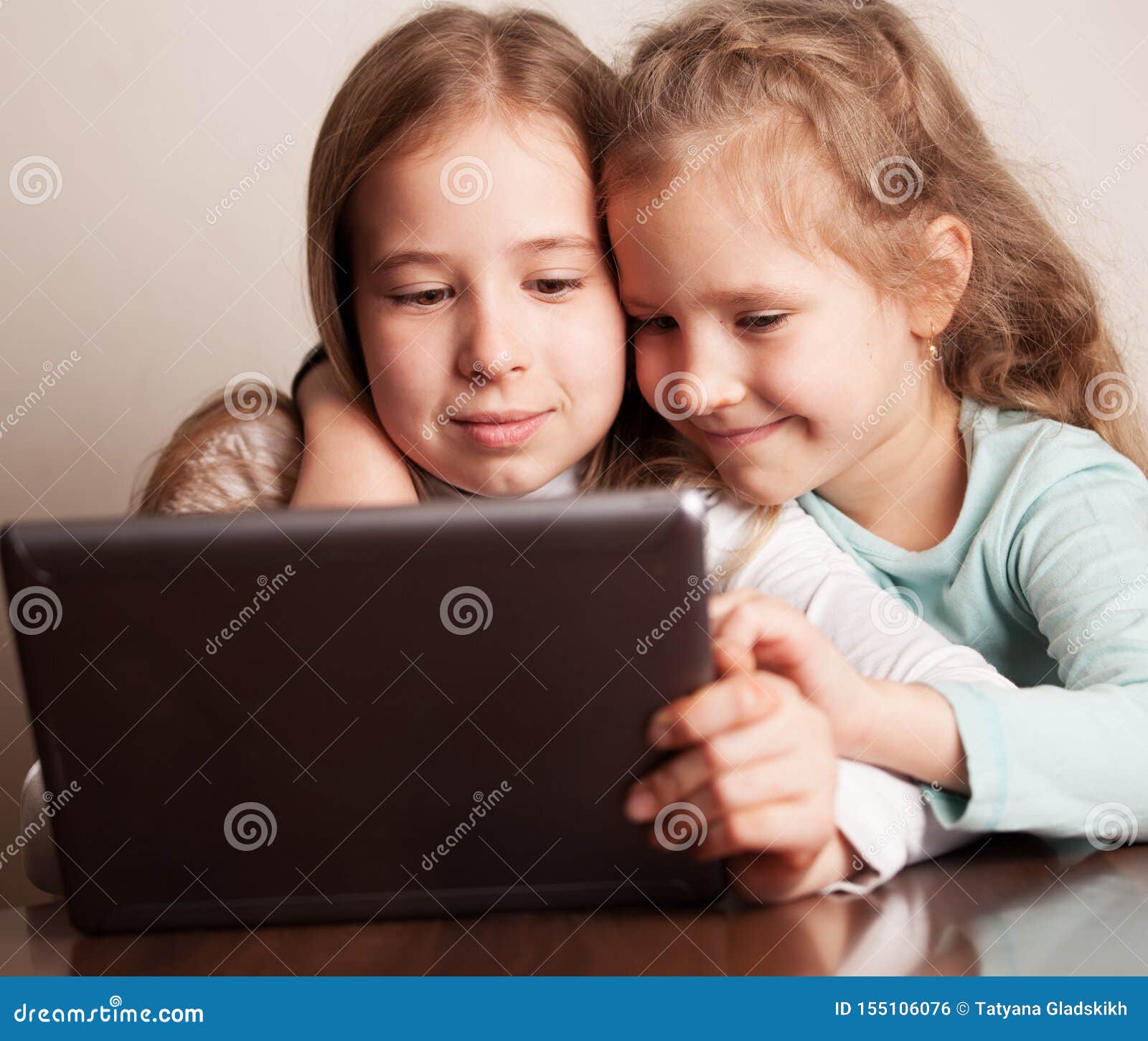Children playing on tablet stock photo. Image of offspring - 155106076