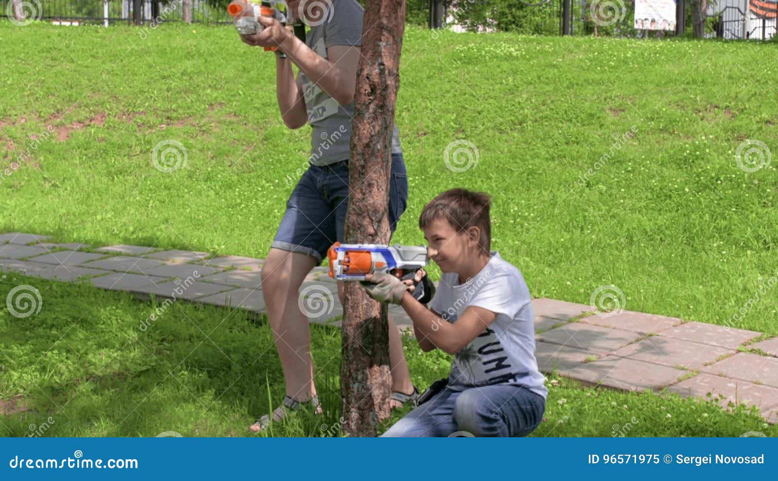 The Children is Playing in the War. Game on Green Grass. Summer ...