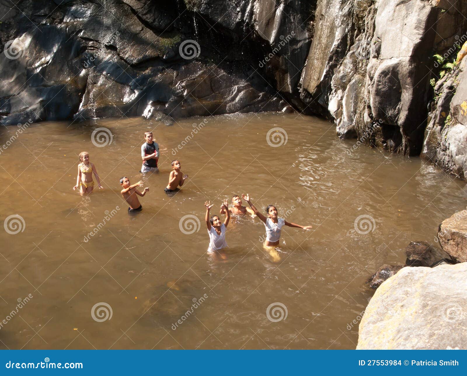 Children playing in water editorial stock image. Image of central ...
