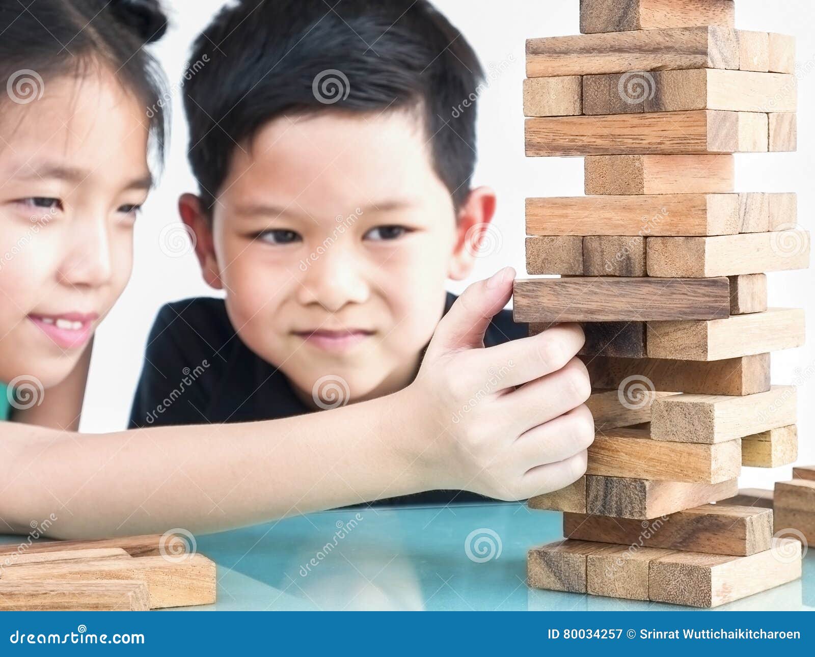 Children are Playing a Wood Blocks Tower Game Stock Image - Image of ...