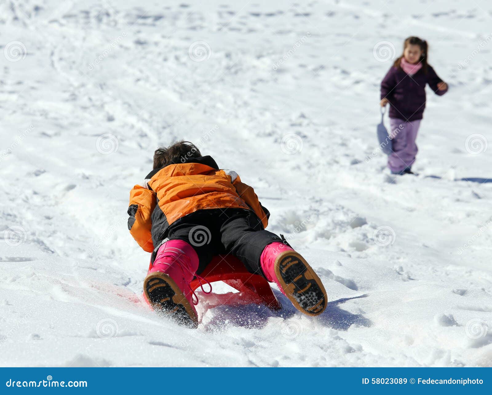 Children Plays with Sledging in Winter on the Snow Stock Image - Image ...