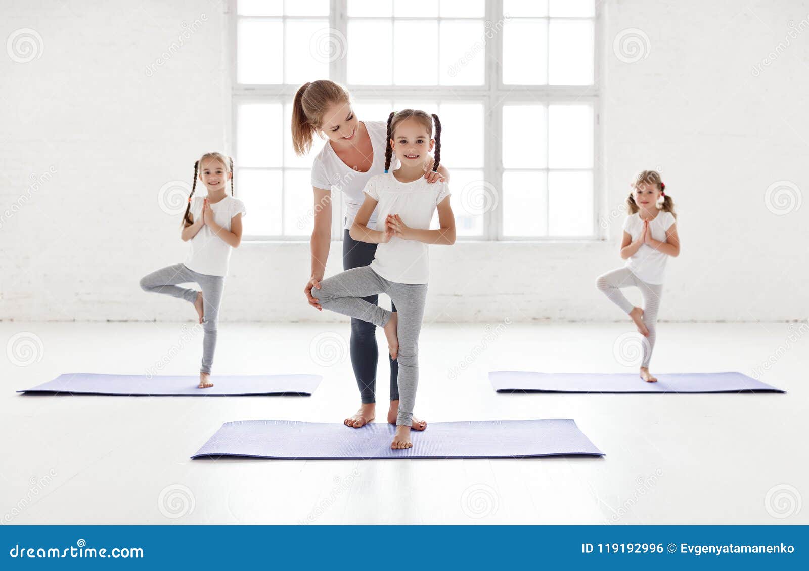 Children Practicing Engaged in Gymnastics and Yoga with Teacher Stock ...