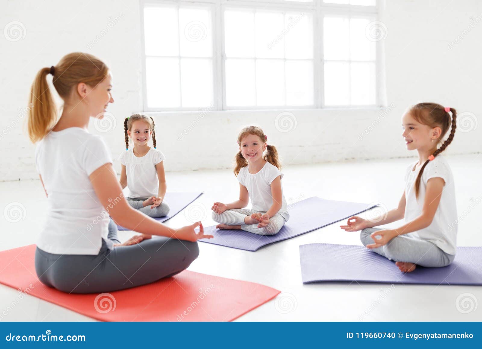 Children Practicing Engaged in Gymnastics and Yoga with Teacher Stock ...