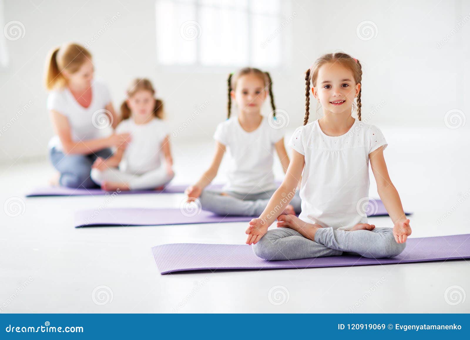 Children Practicing Engaged in Gymnastics and Yoga with Teacher Stock ...