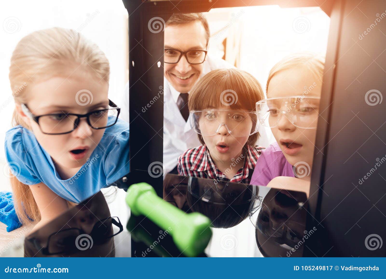 Children Print Different Items on a 3d Printer with a Teacher. Stock ...