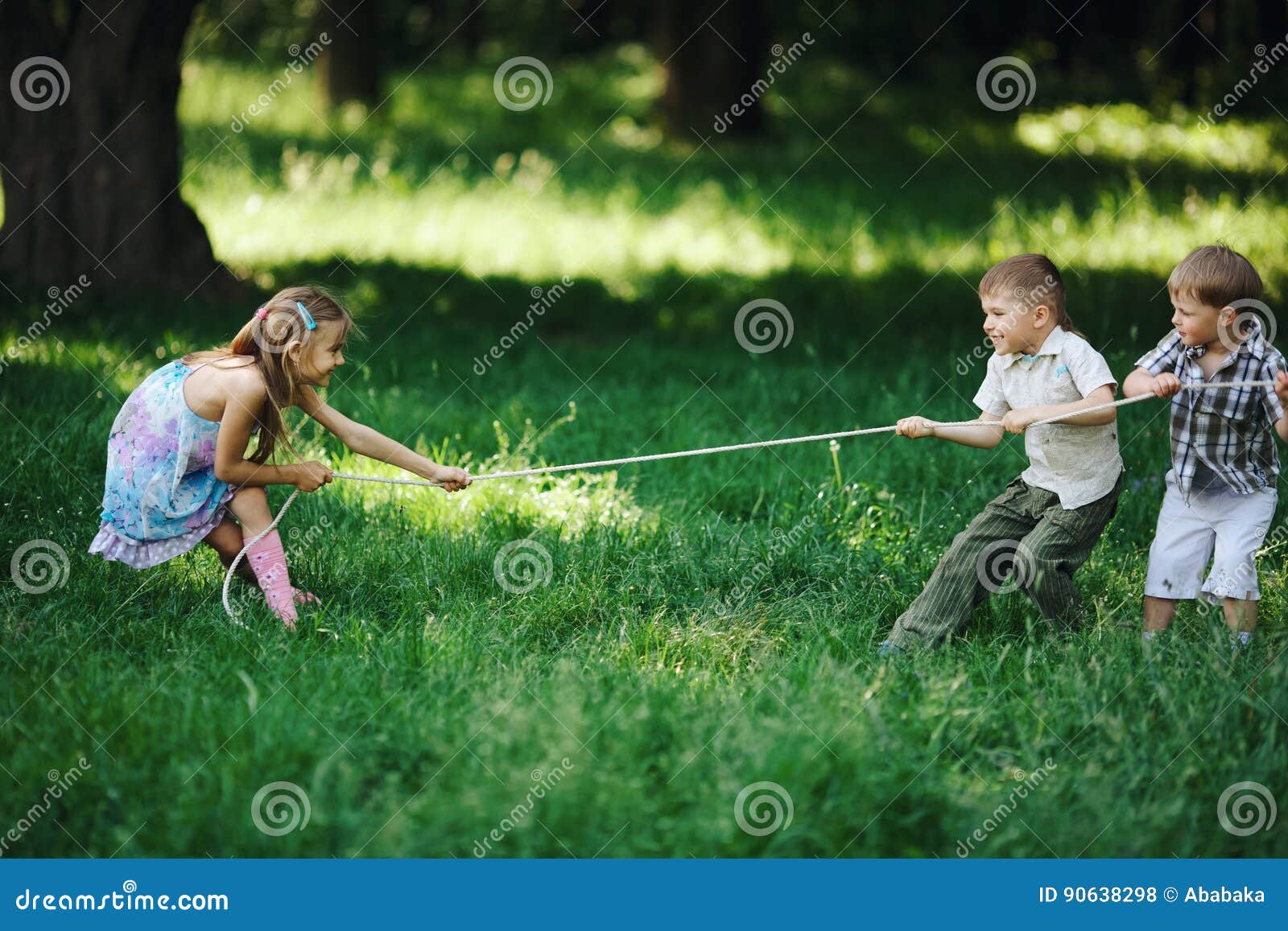Children Pulling the Rope Outdoors Stock Photo - Image of kids, park ...