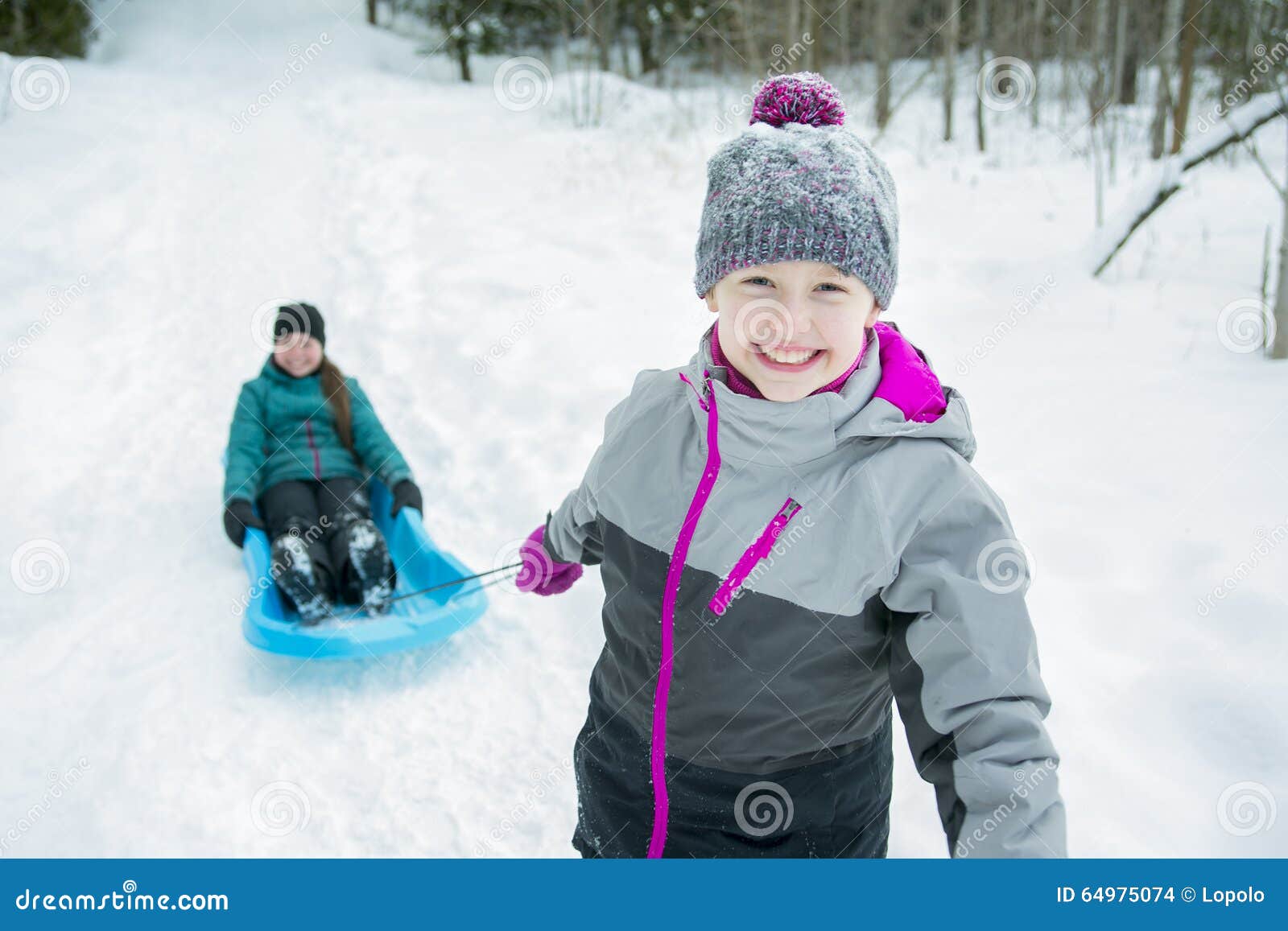 Children Pulling Sledge through Snowy Landscape Stock Photo - Image of ...