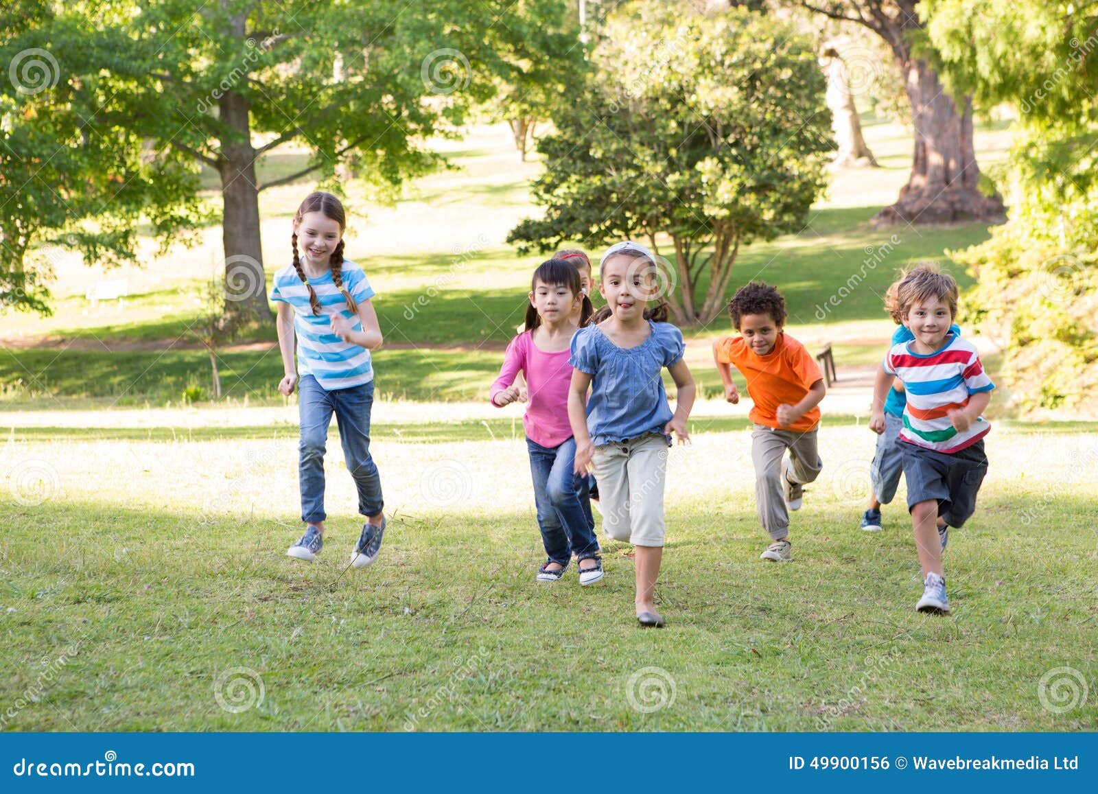 Children Racing in the Park Stock Photo - Image of carefree, action ...