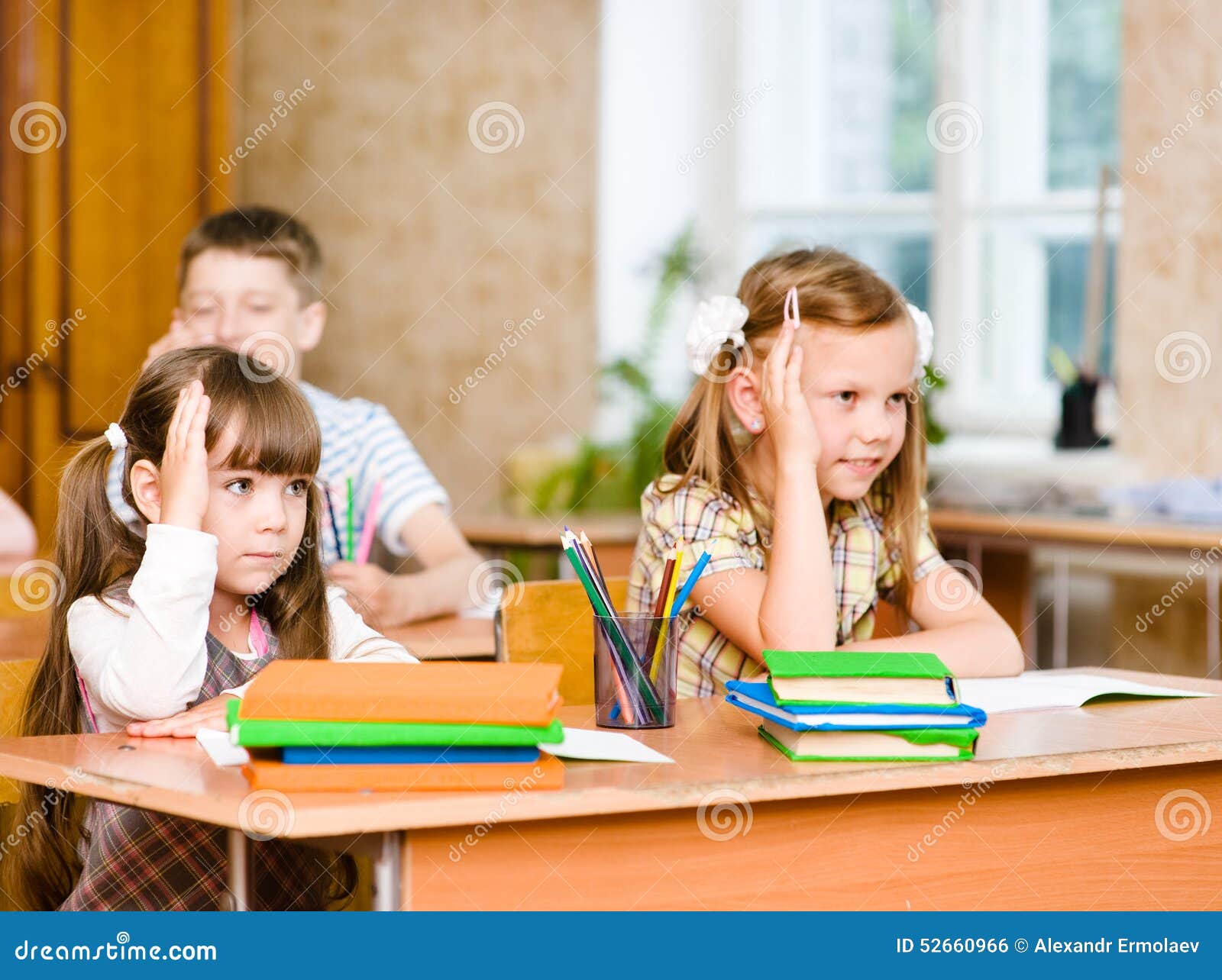Children Raising Hands Knowing the Answer To the Question Stock Photo ...
