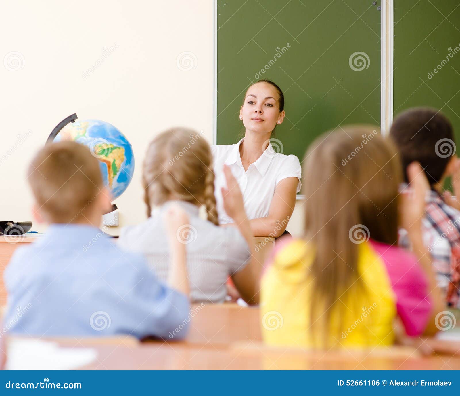 Children Raising Hands Knowing the Answer To the Question Stock Photo ...