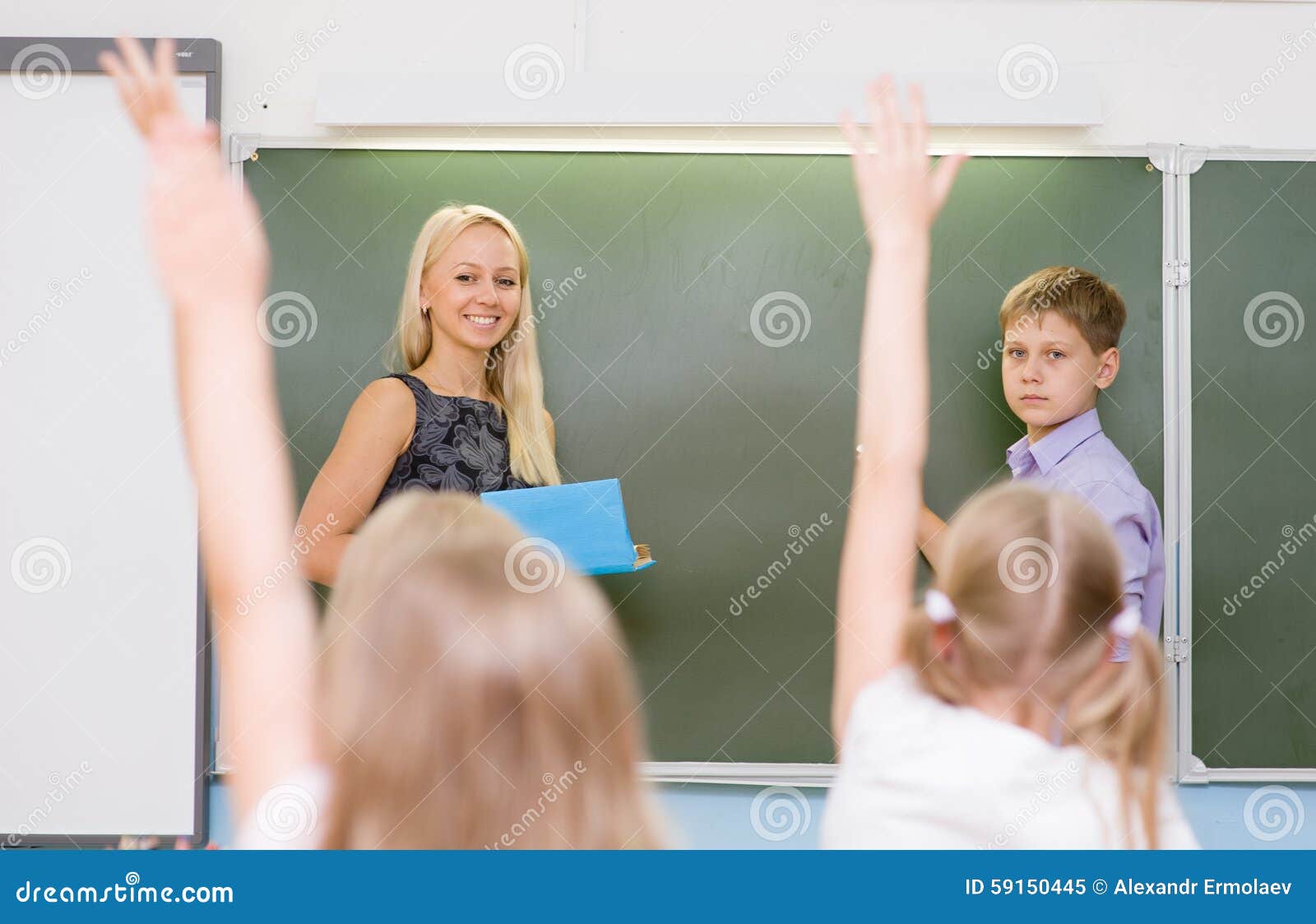 Children Raising Hands Knowing the Answer To the Question Stock Image ...