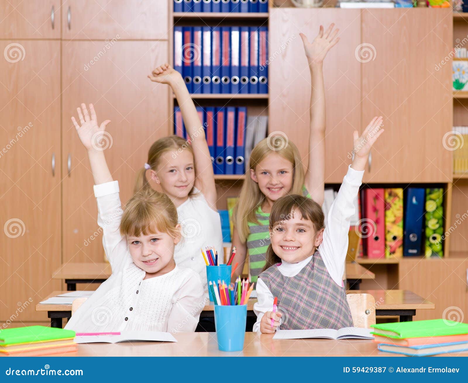 Children Raising Hands Knowing the Answer To the Question Stock Image ...