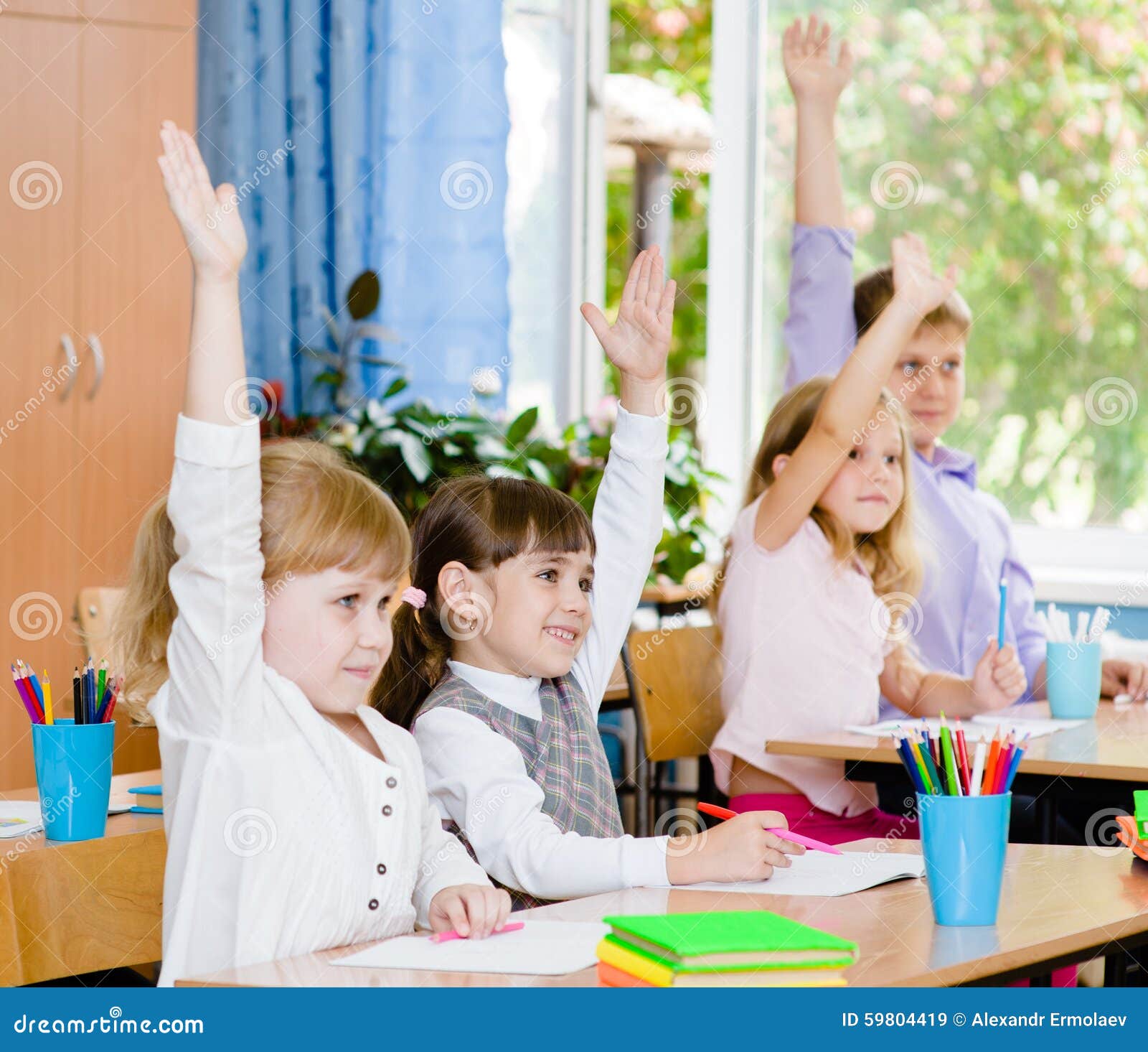 Children Raising Hands Knowing the Answer To the Question Stock Image ...