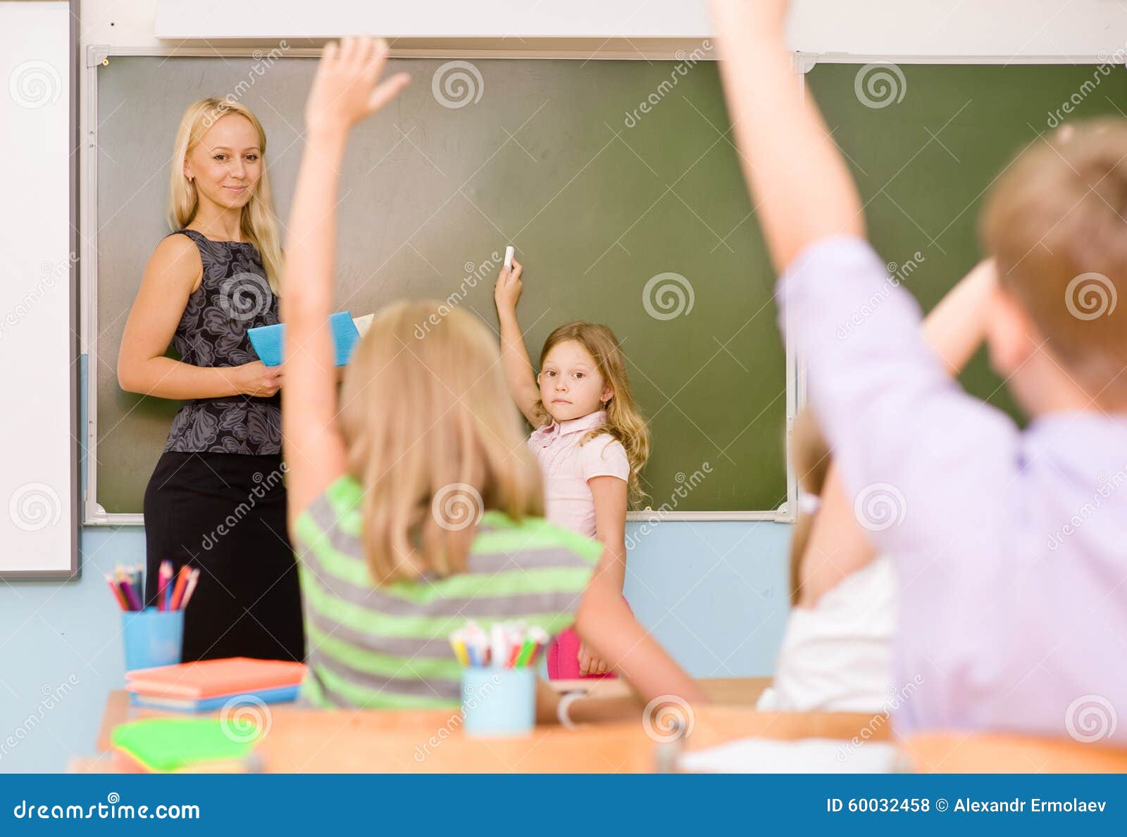 Children Raising Hands Knowing the Answer To the Question Stock Photo ...