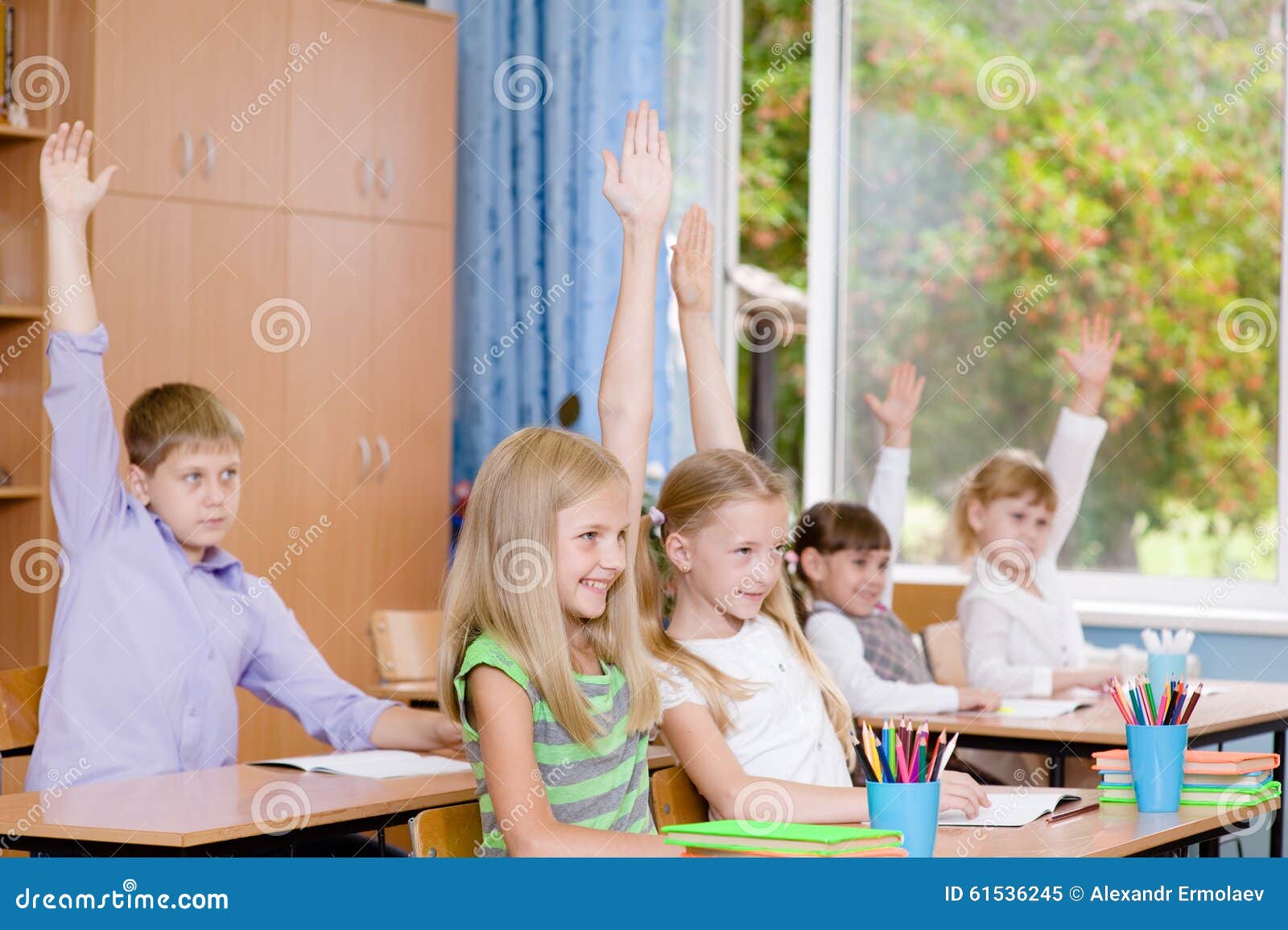 Children Raising Hands Knowing the Answer To the Question Stock Image ...