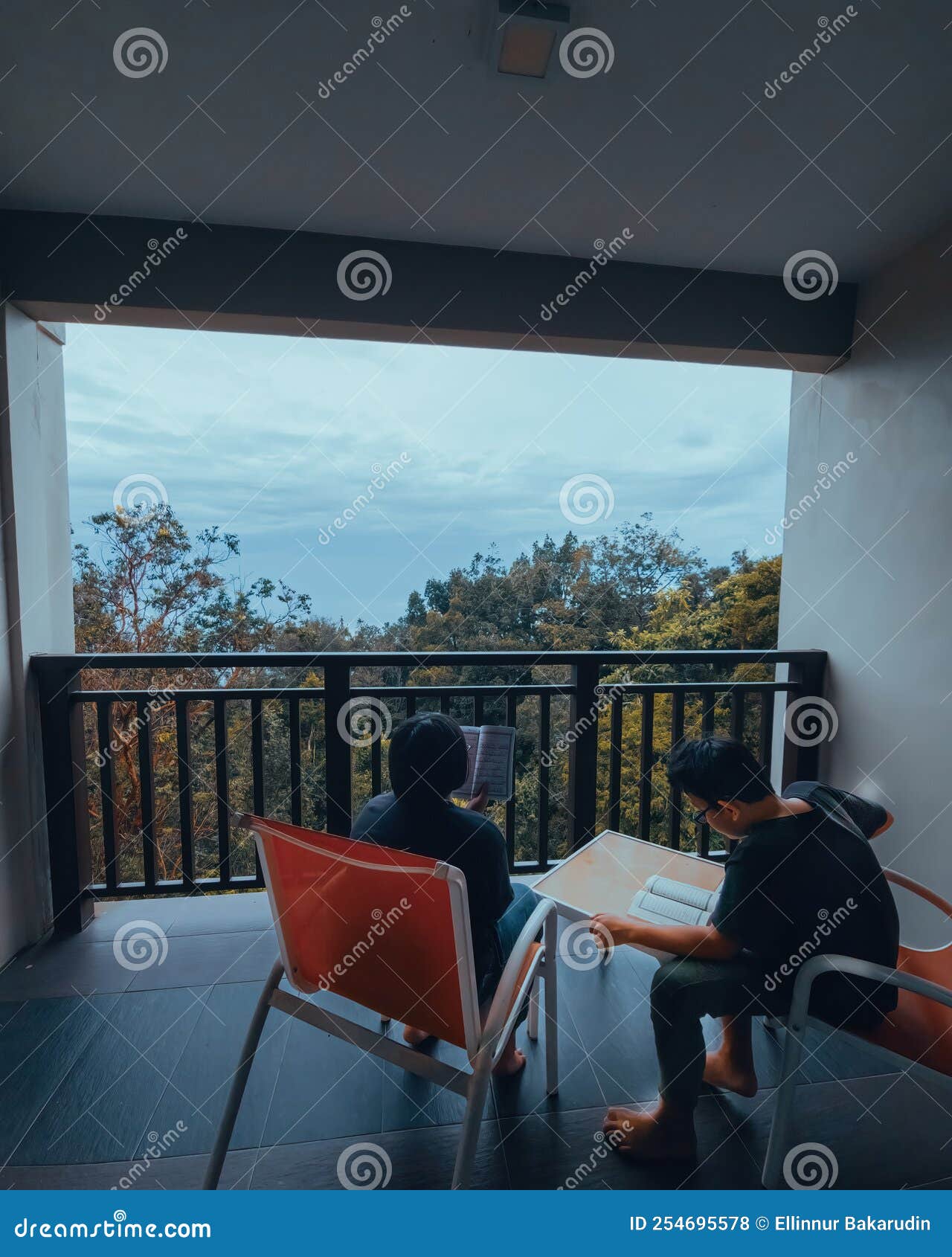 Children Reading at the Balcony while Enjoying the View of the Forest ...