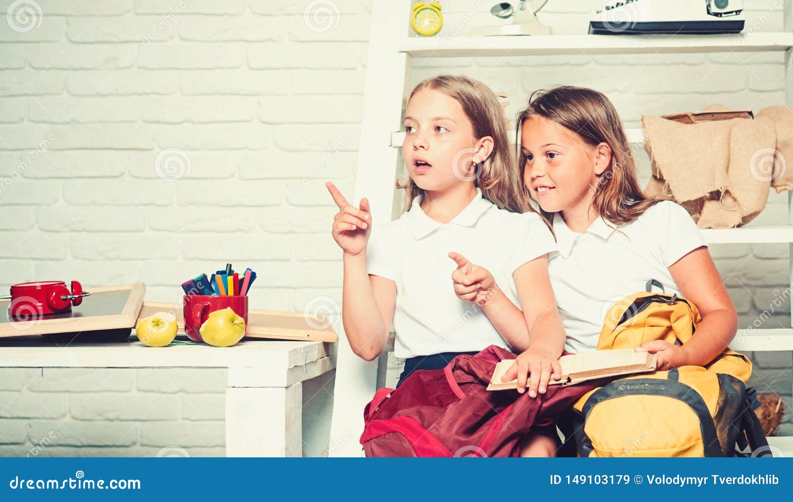 Children Reading from Books Together while Sitting Down. Stock Image ...