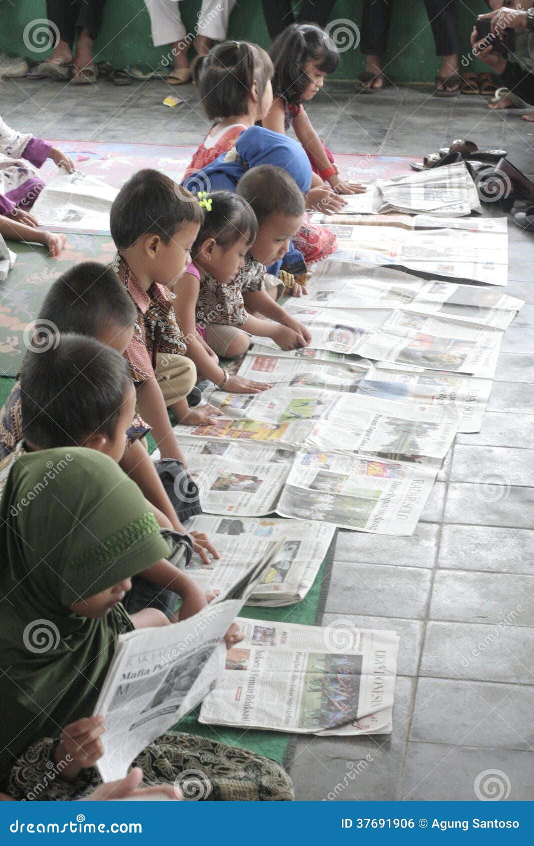 CHILDREN READING a NEWSPAPER on a NATIONAL PRESS Editorial Photo ...