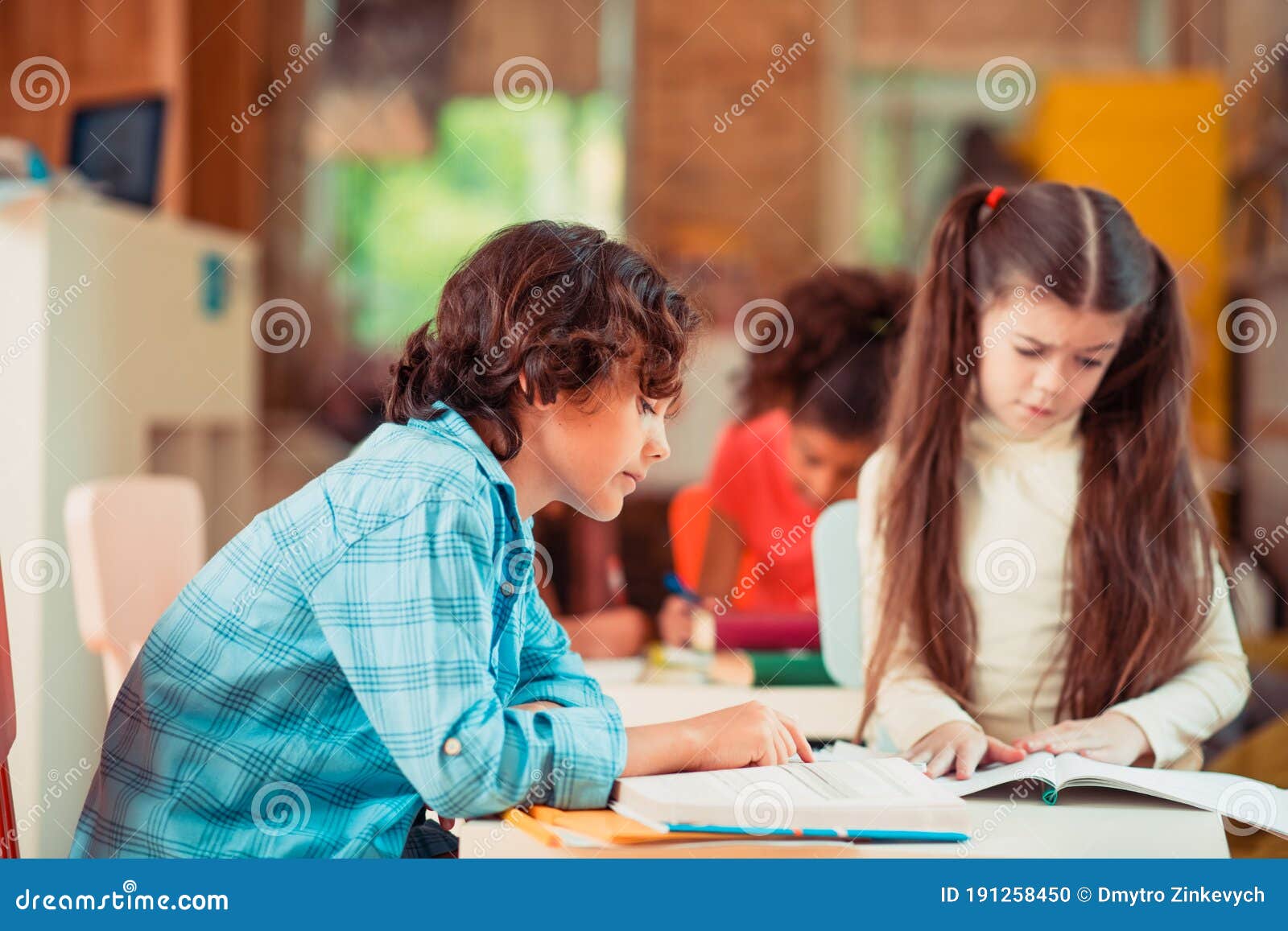Children Reading Texts Together during the Class Stock Photo - Image of ...