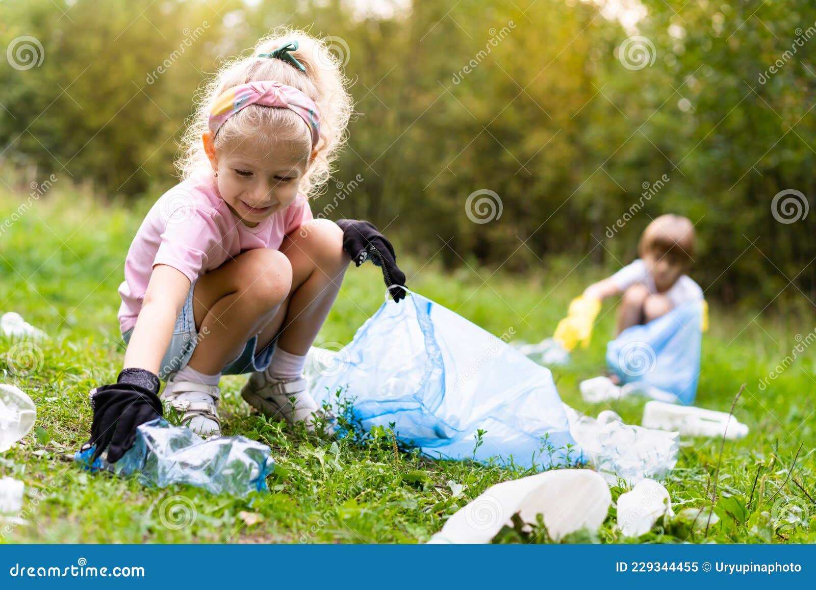 Children Remove Plastic Garbage and Put it in a Biodegradable Garbage ...