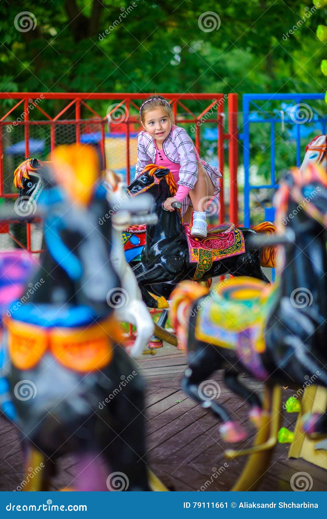 Children ride roundabouts stock image. Image of playful - 79111661