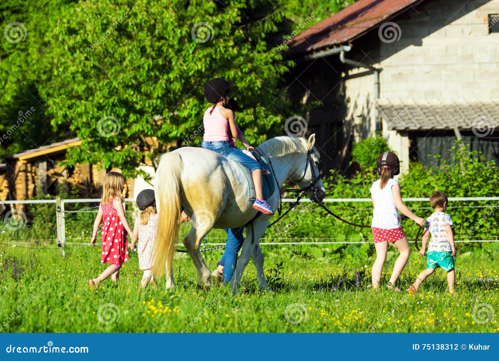 Children riding horse editorial photography. Image of helmet - 75138312
