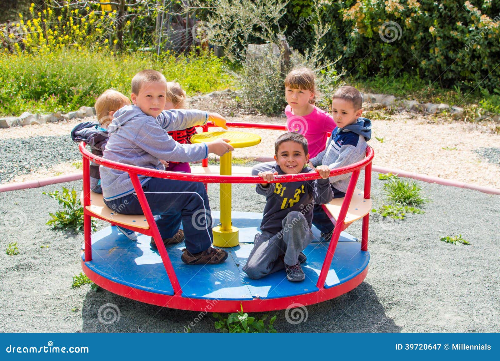 Children riding roundabout stock image. Image of five - 39720647