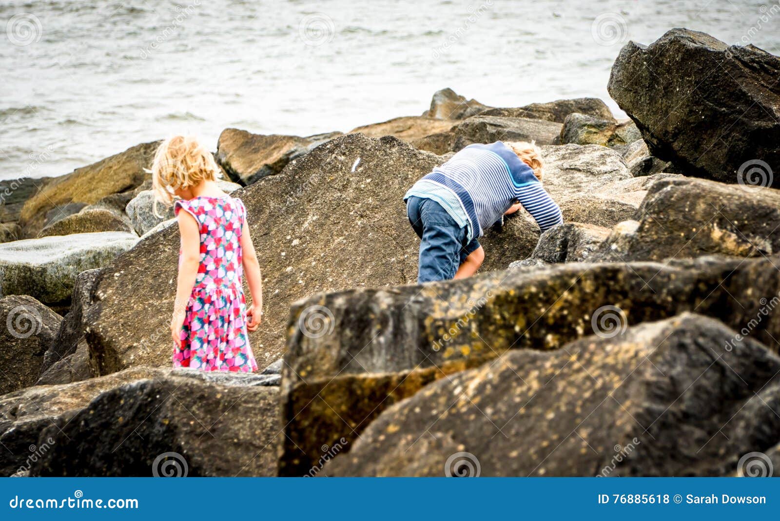 Children Exploring Rock Formations At Crescent Bay In Laguna Beach ...