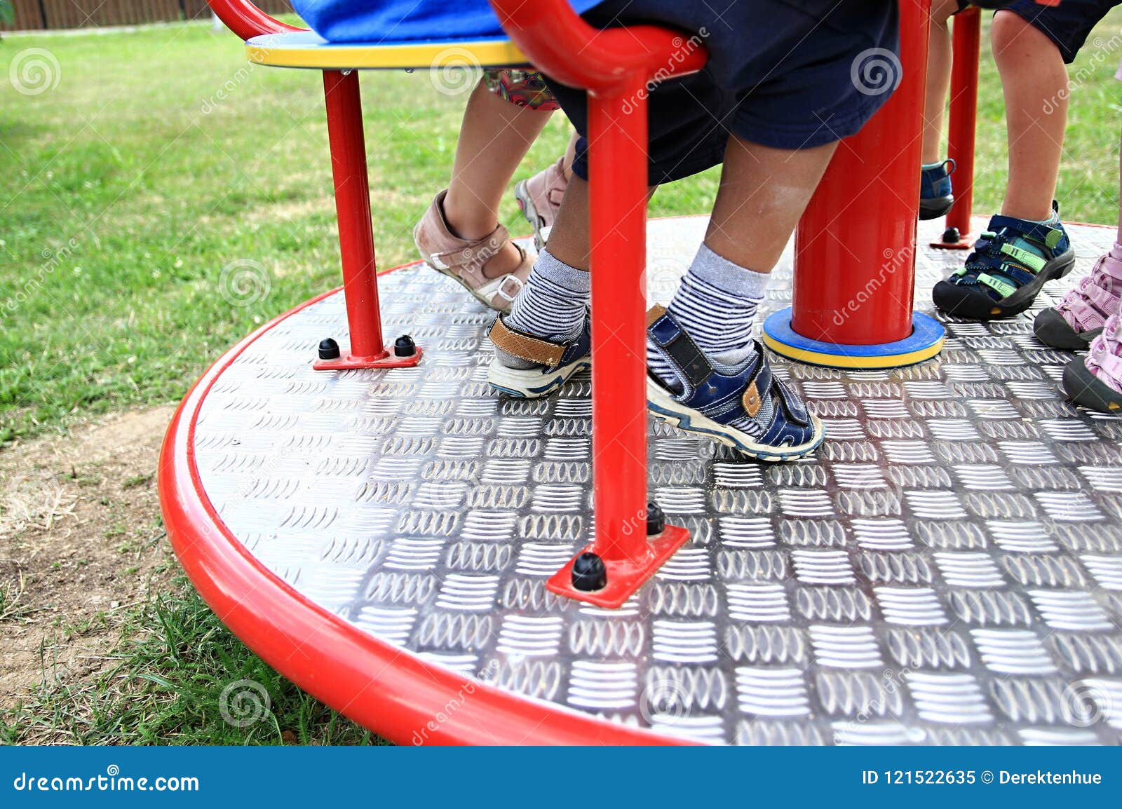 Children on a Roundabout at a Playground Stock Image - Image of sunny ...