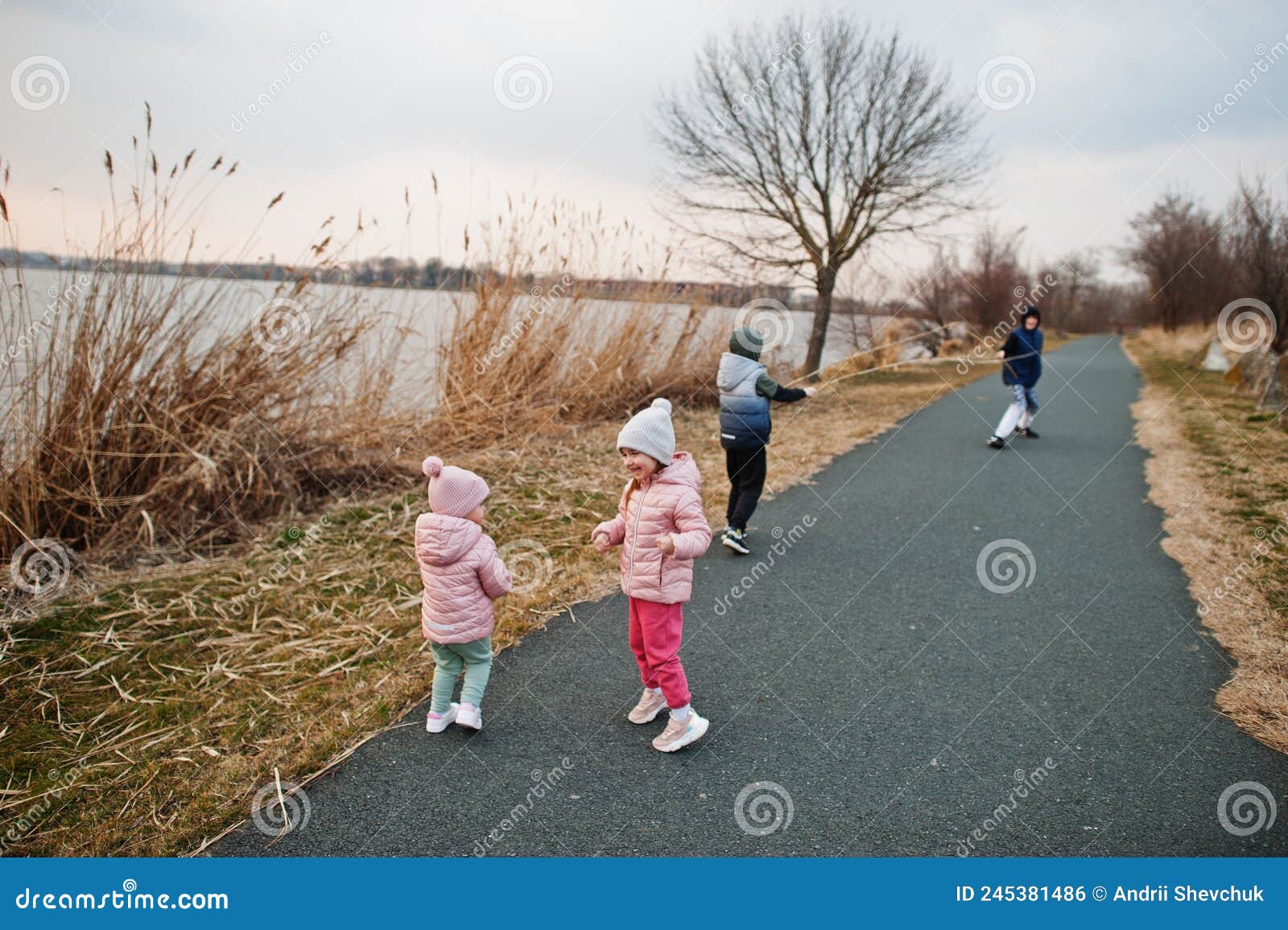 Children Run on the Path by the Lake Stock Photo - Image of grass ...