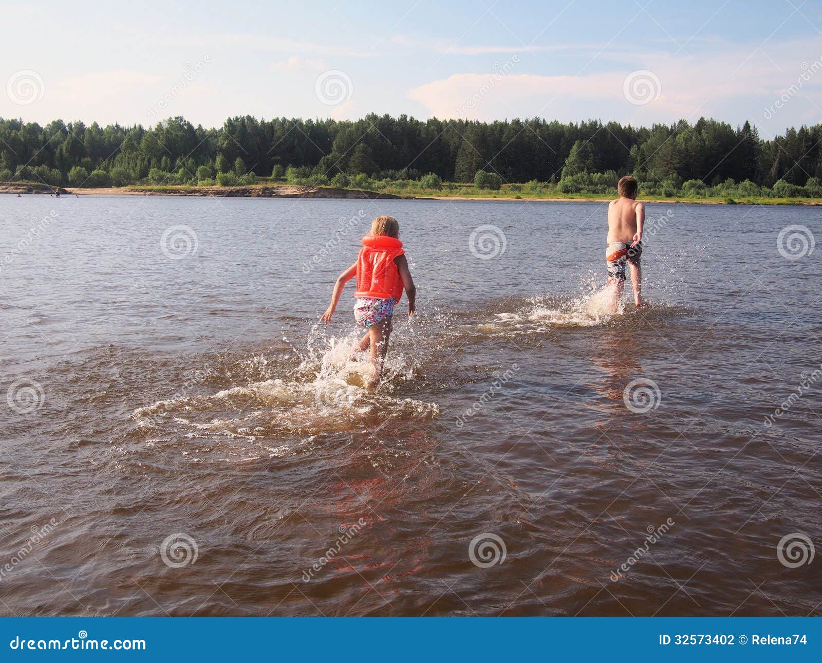 Children run in river stock photo. Image of jacket, river - 32573402