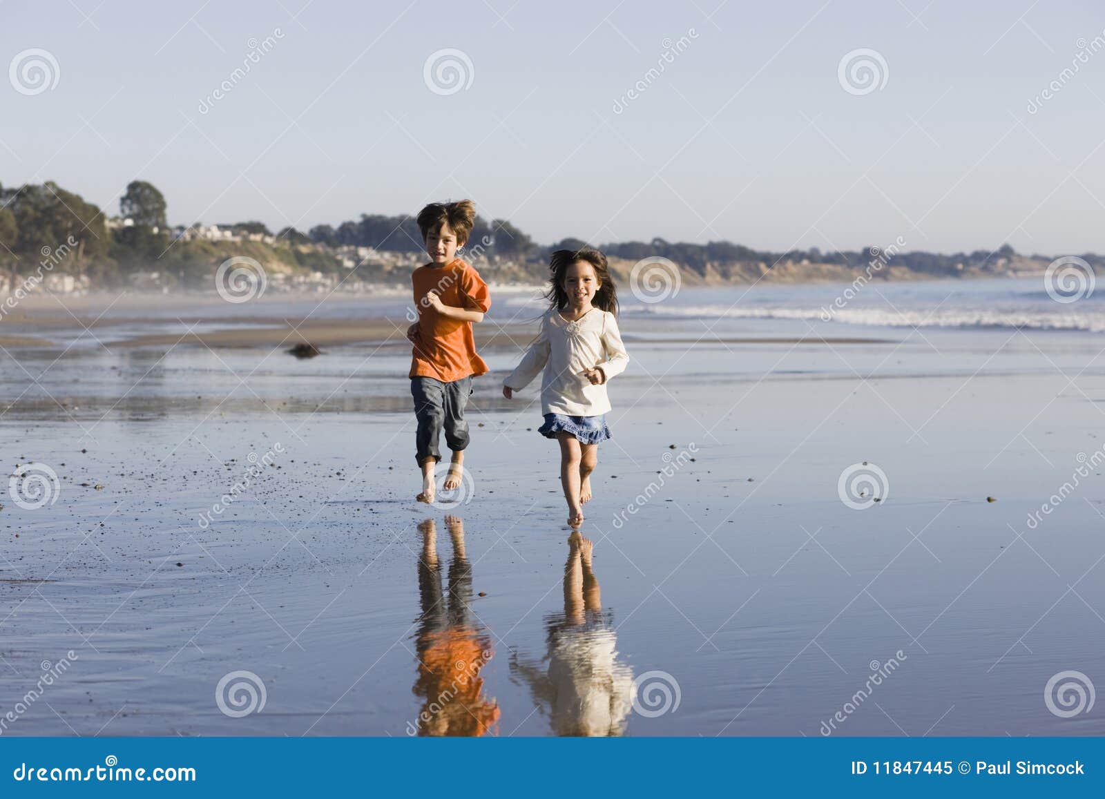 Children Running on Beach stock image. Image of playful - 11847445