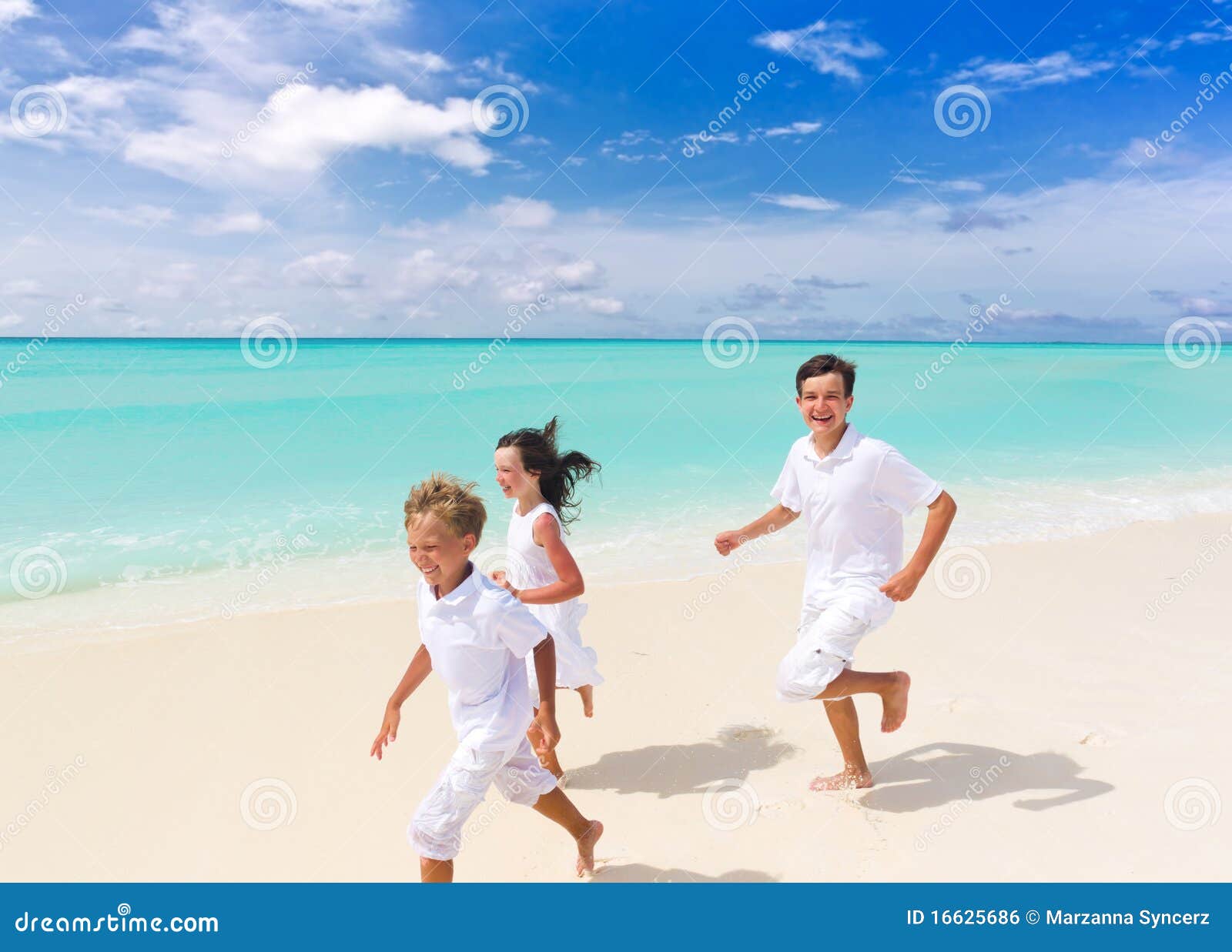 Children running on beach stock photo. Image of blue - 16625686