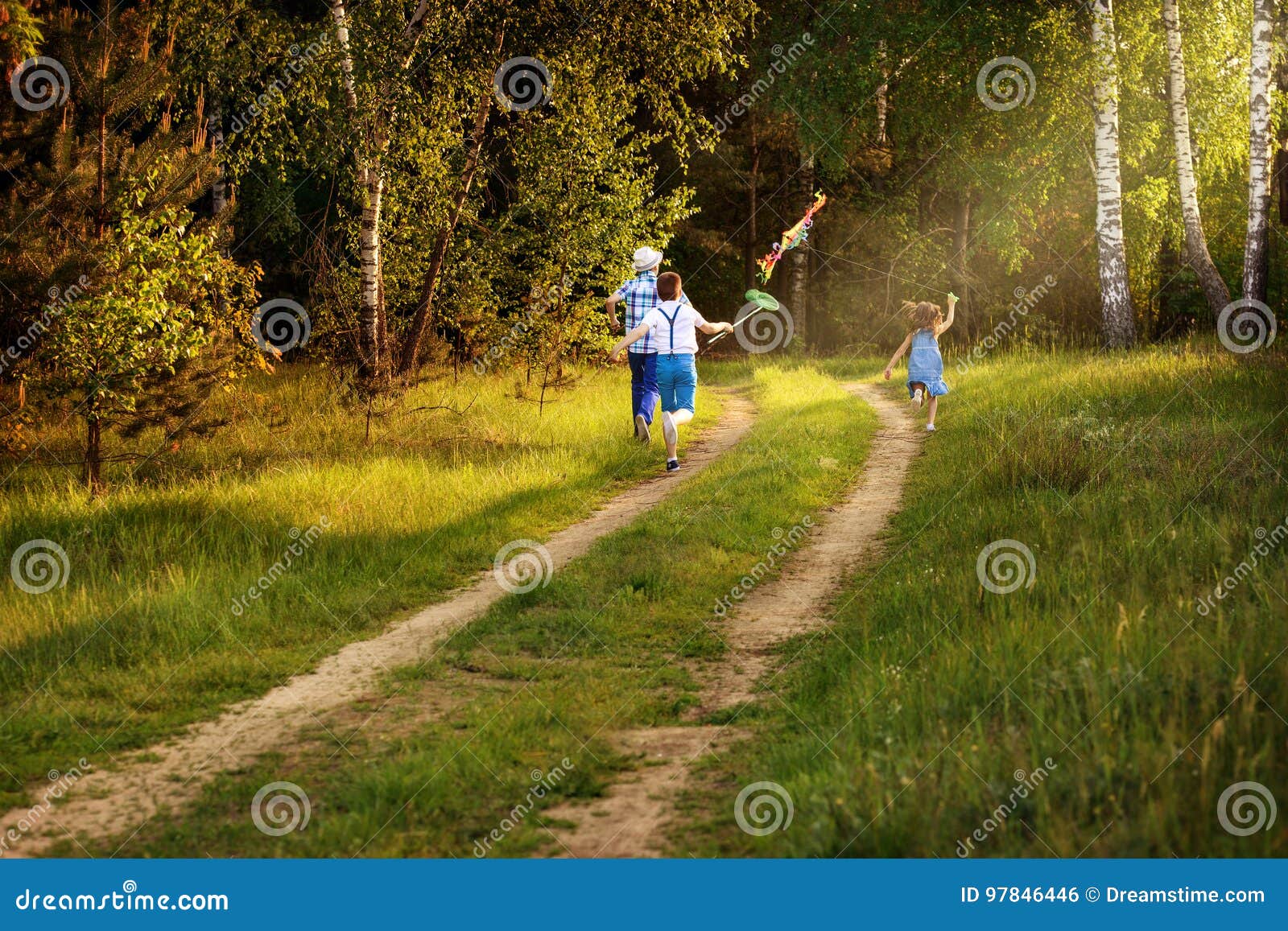 Children Running on the Nature at Sunset with Ray of Light Stock Photo ...