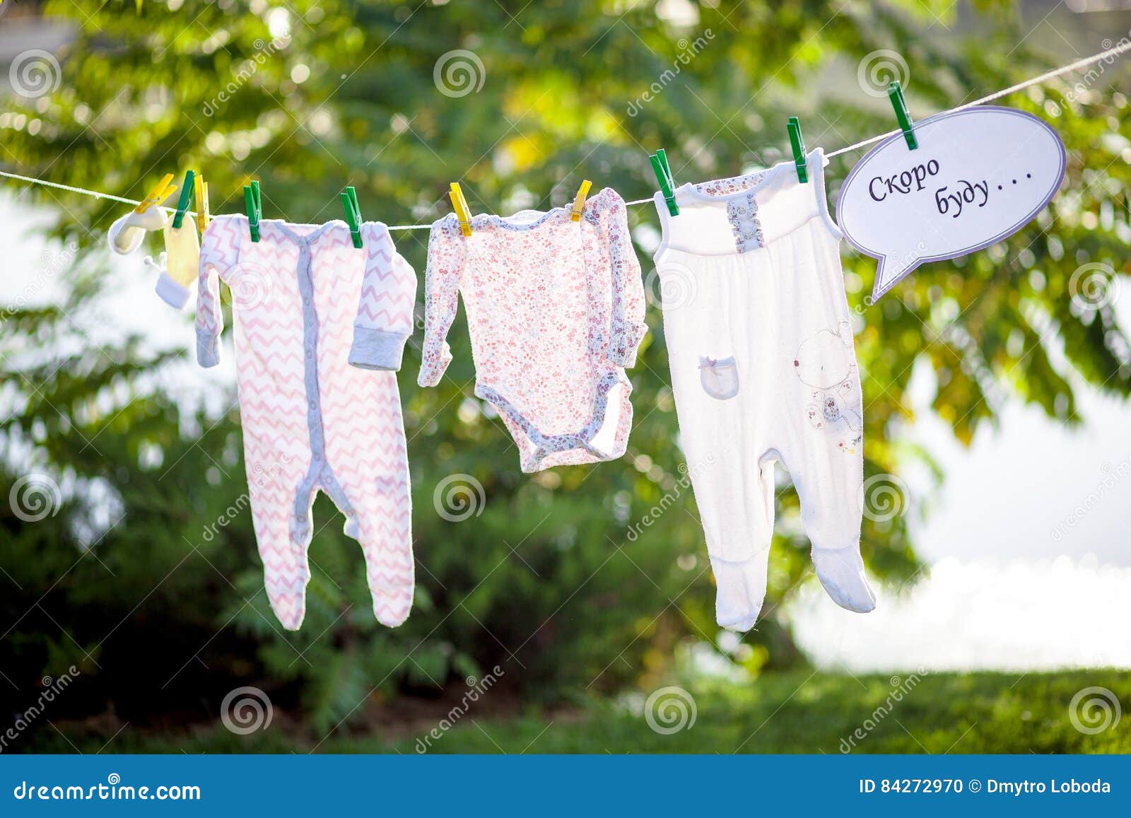 Children`s Clothes on a Rope in the Park, Expectations Stock Photo ...