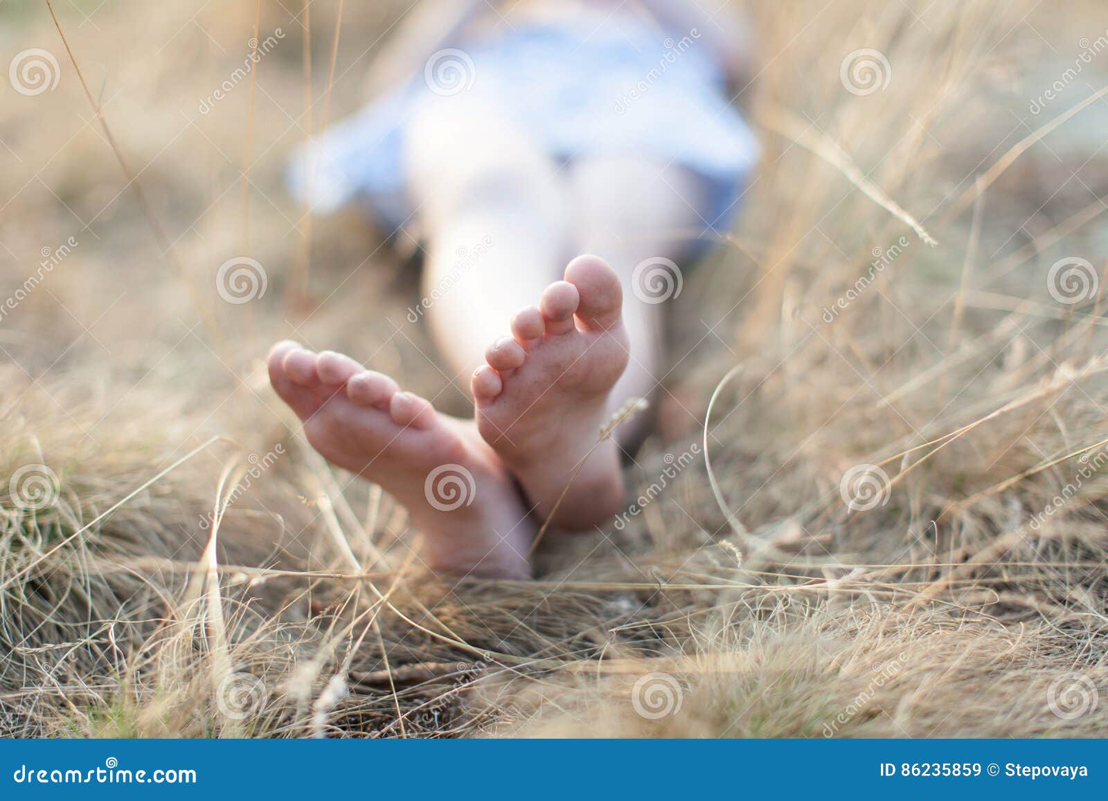 Children`s Feet in the Grass Girl Lying on Grass Relaxing Stock Image ... Children`s Feet in the Grass Girl Lying on Grass Relaxing Stock Image ...