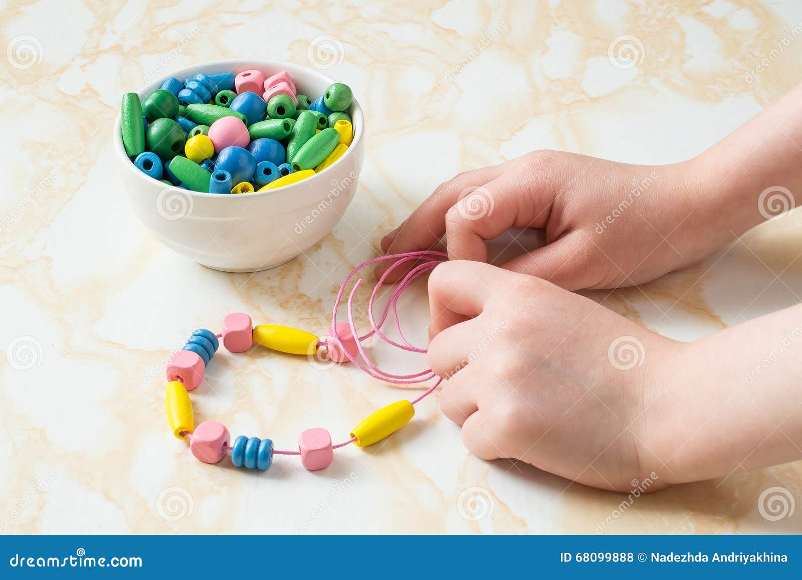 Children S Hands Collect Beads on a String Stock Photo - Image of ...