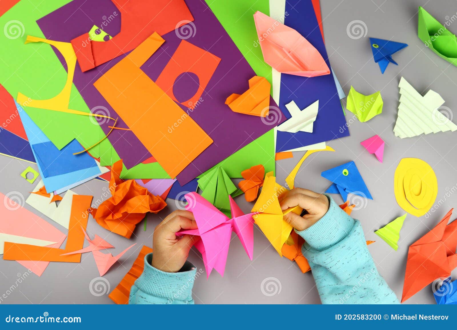 Children S Hands Make Origami Crafts from Colored Paper Stock Photo ...