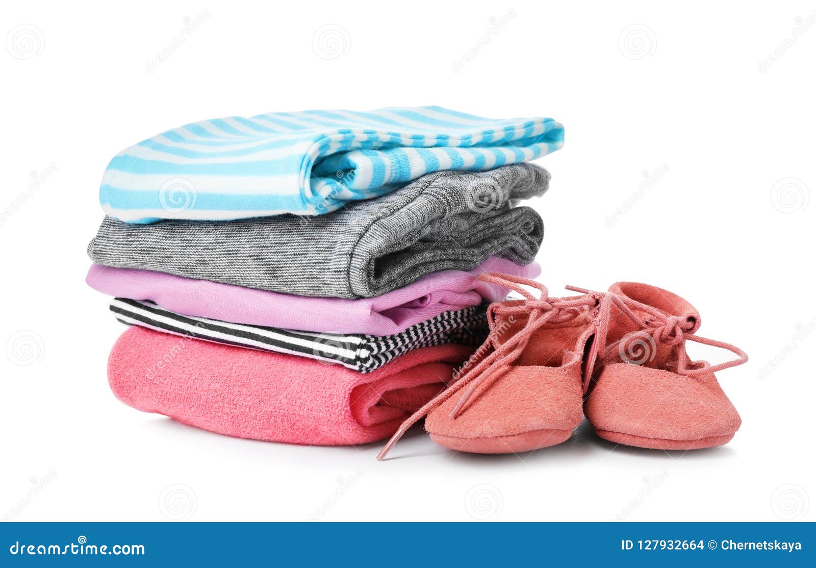 Children`s Shoes and Stack of Clothes Stock Photo - Image of foot ...