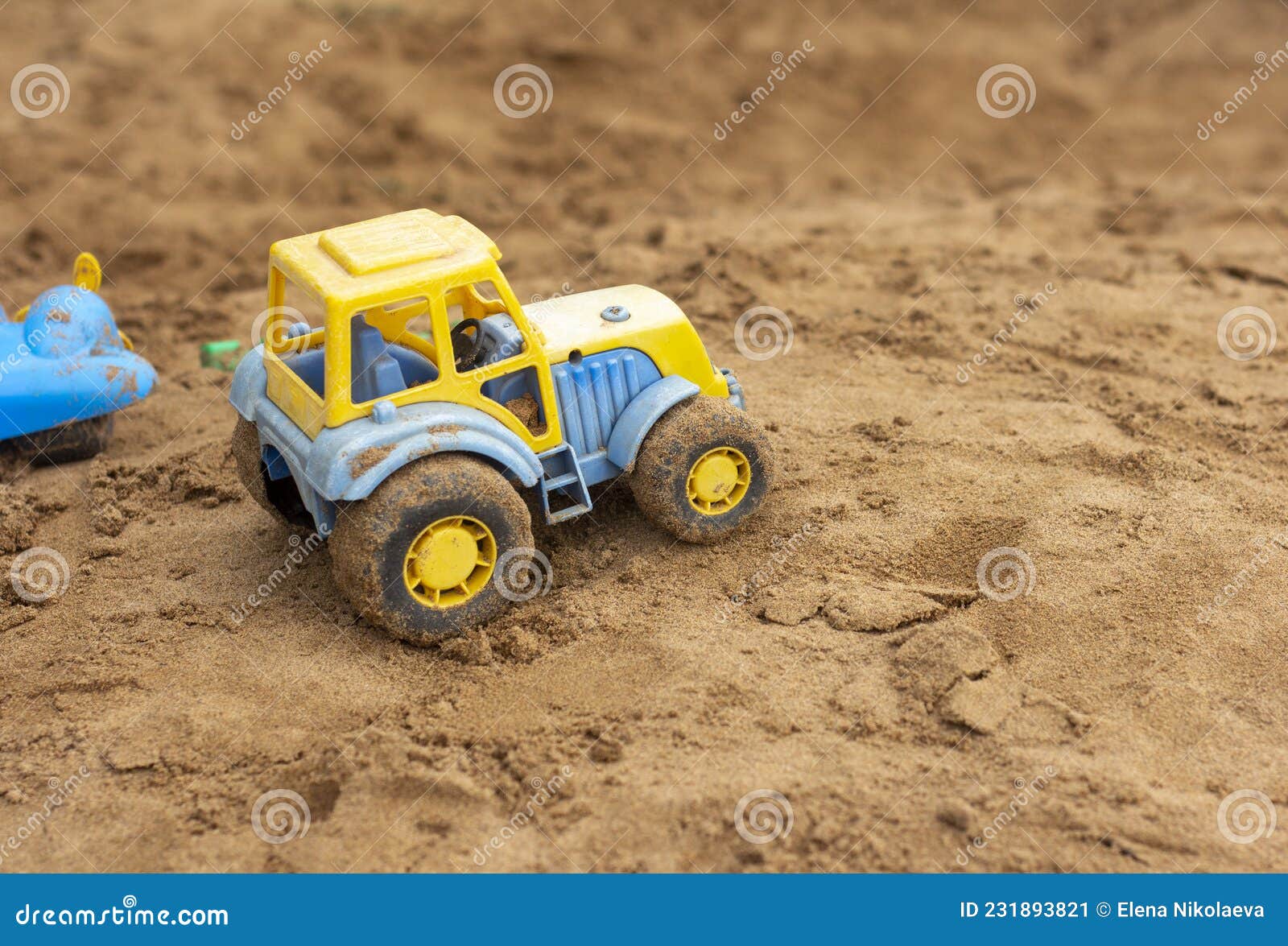 Children`s Toy Tractor on the Sandbox.a Forgotten Toy Stock Image ...