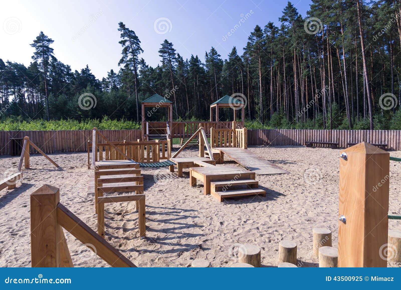 Wooden Playground With Swings, Slide And Stairs On The Background Of A ...