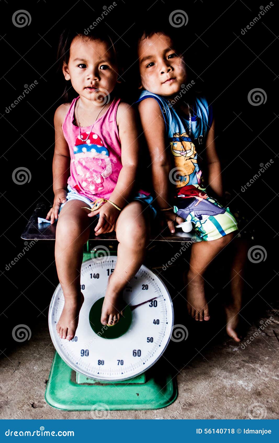 Children on scales stock photo. Image of adorable, lying - 56140718
