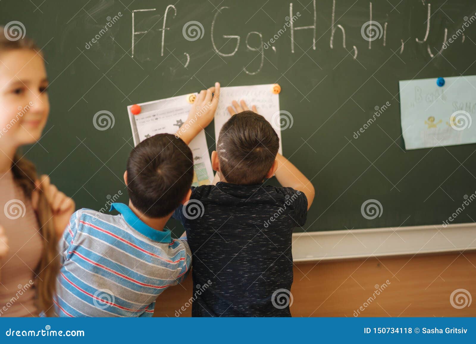 Children in School Stand by the Blackboard. Elementary School Stock ...