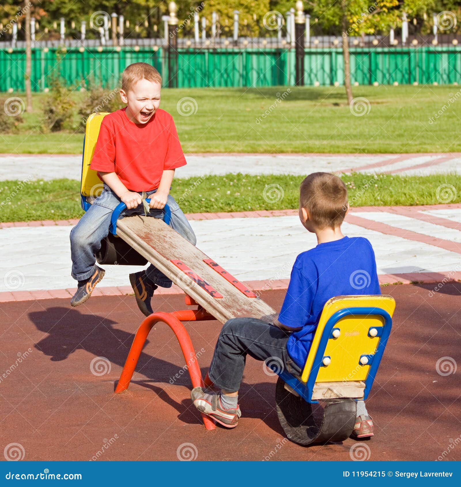 Children on a seesaw stock image. Image of cheerful, childhood - 11954215