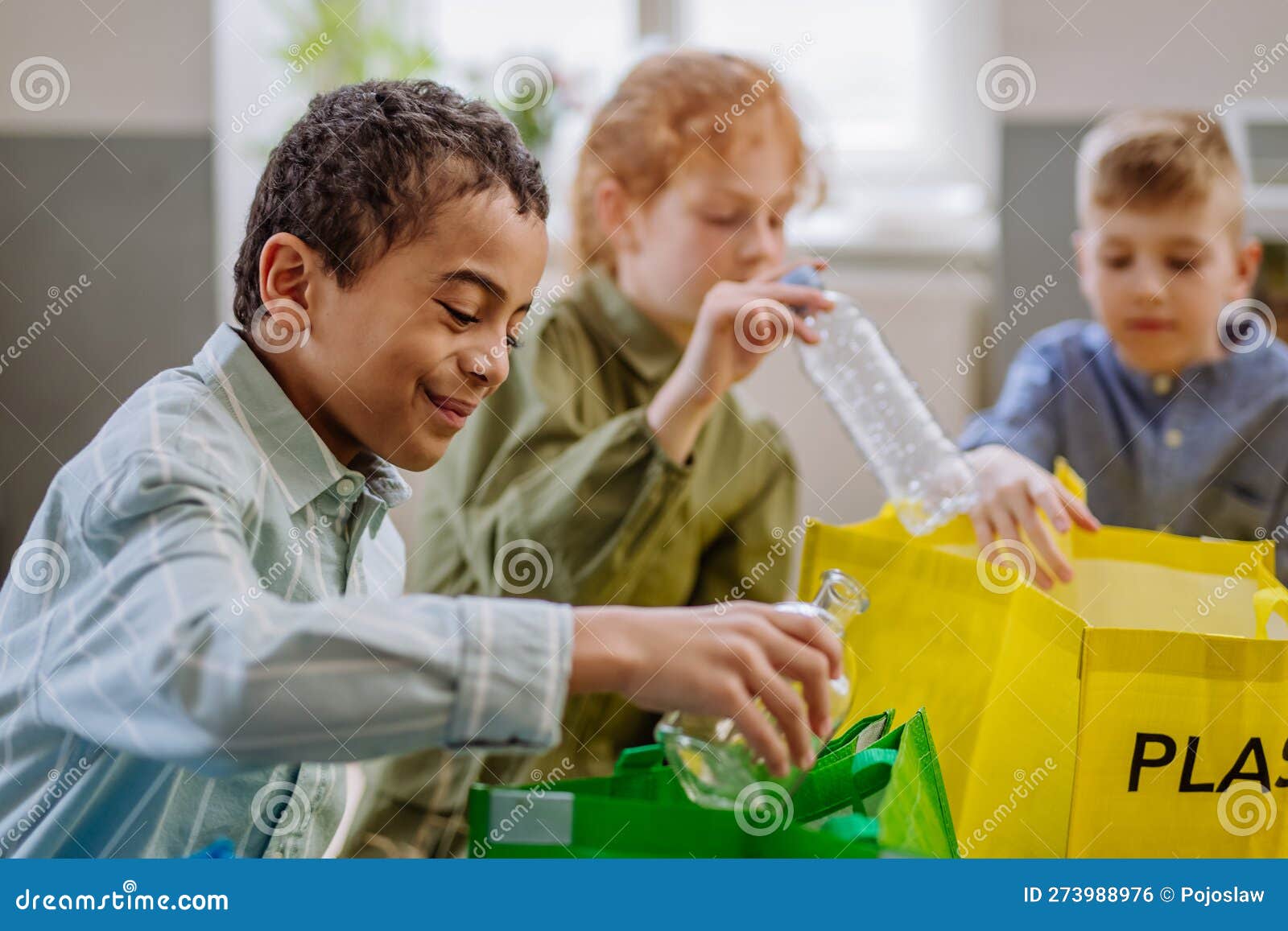 Children Separating Rubish in To Three Bins. Stock Photo - Image of ...