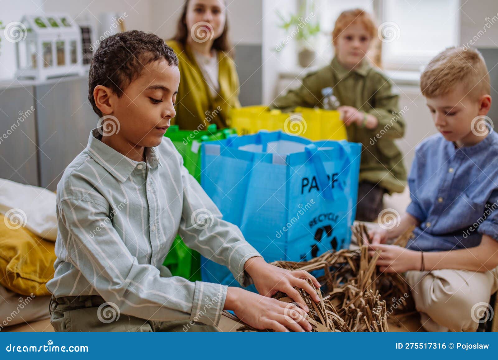 Children Separating Rubish in To Three Bins. Stock Photo - Image of ...