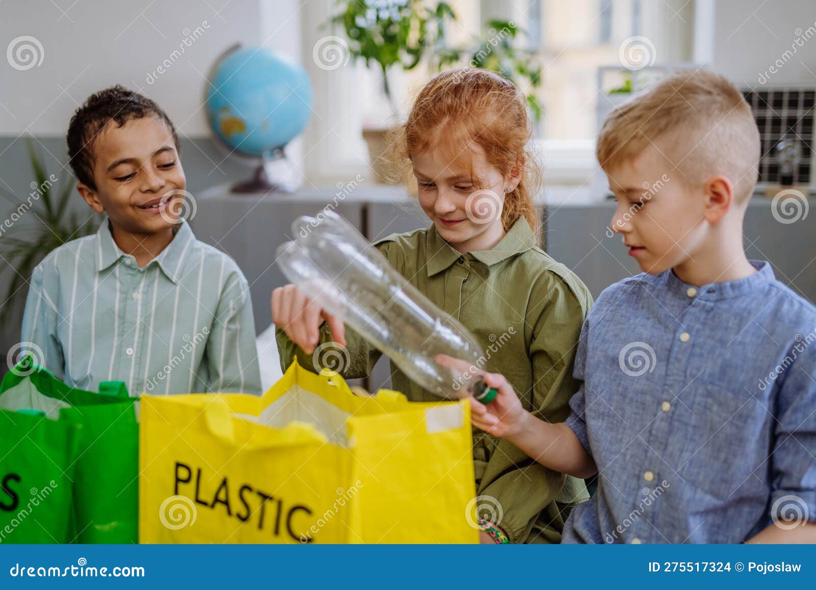 Children Separating Rubish in To Three Bins. Stock Photo - Image of ...