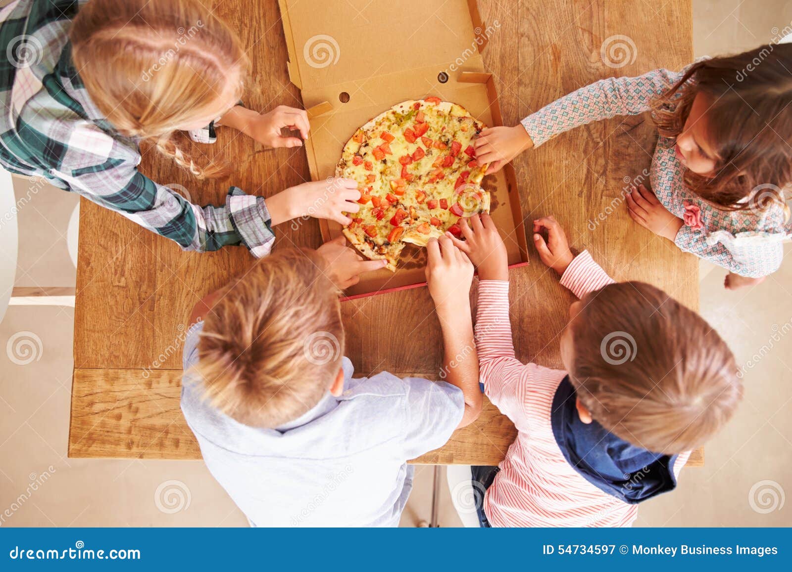 Children Sharing A Pizza Together, Overhead View Stock Photo - Image ...